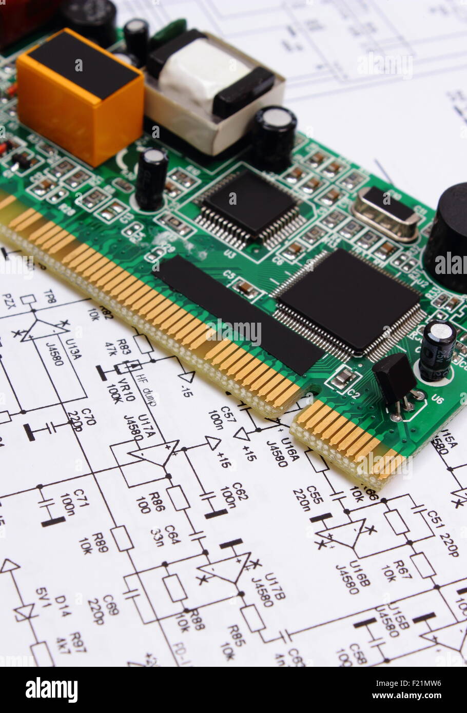 Printed circuit board with electrical components lying on construction ...