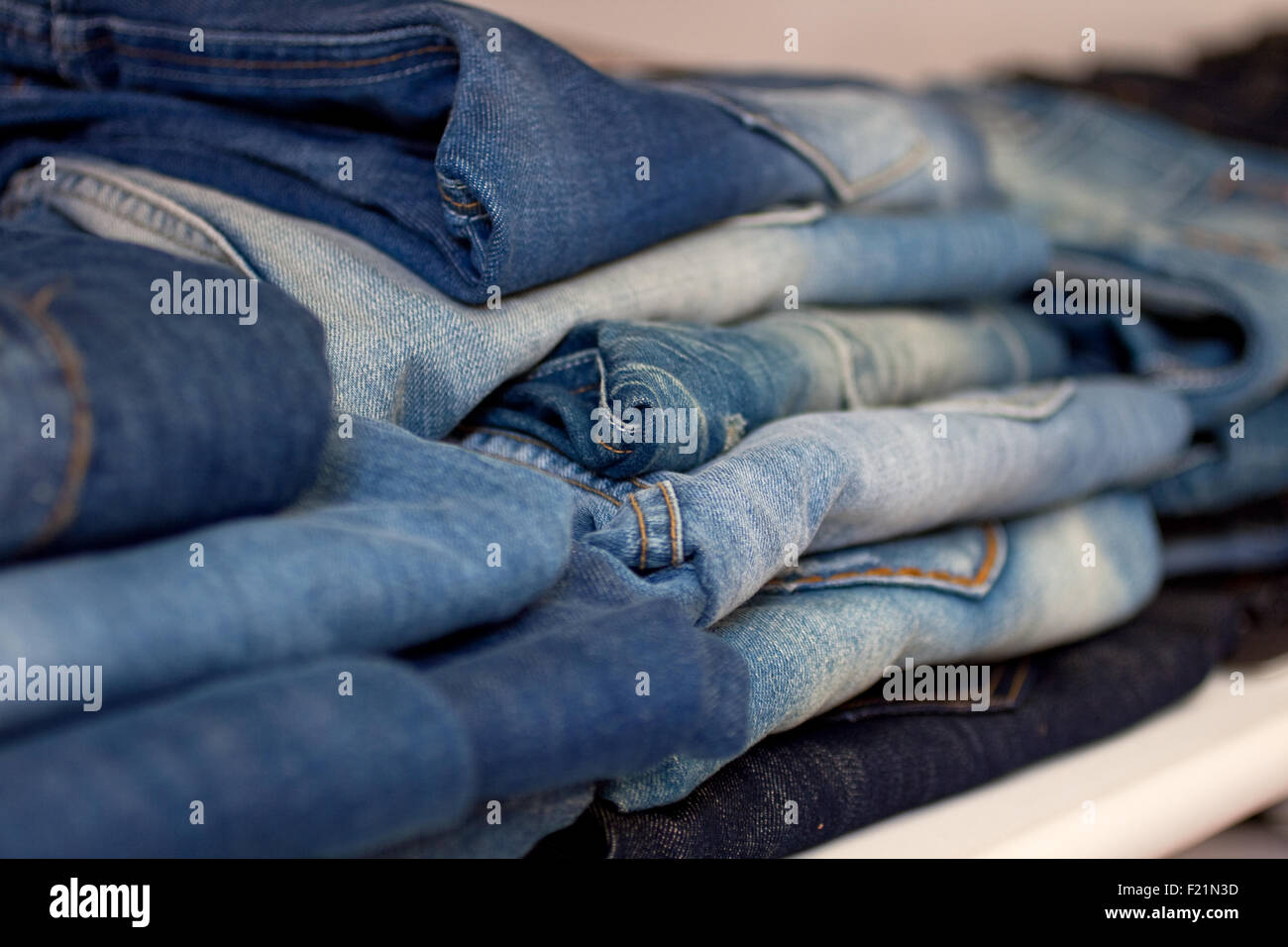 Stacked jeans in store hi-res stock photography and images - Alamy