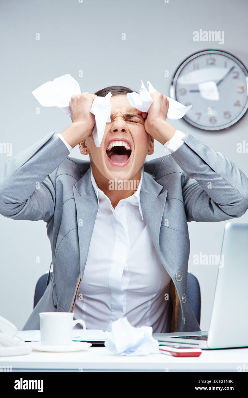 Unhappy businesswoman crying at workplace Stock Photo - Alamy