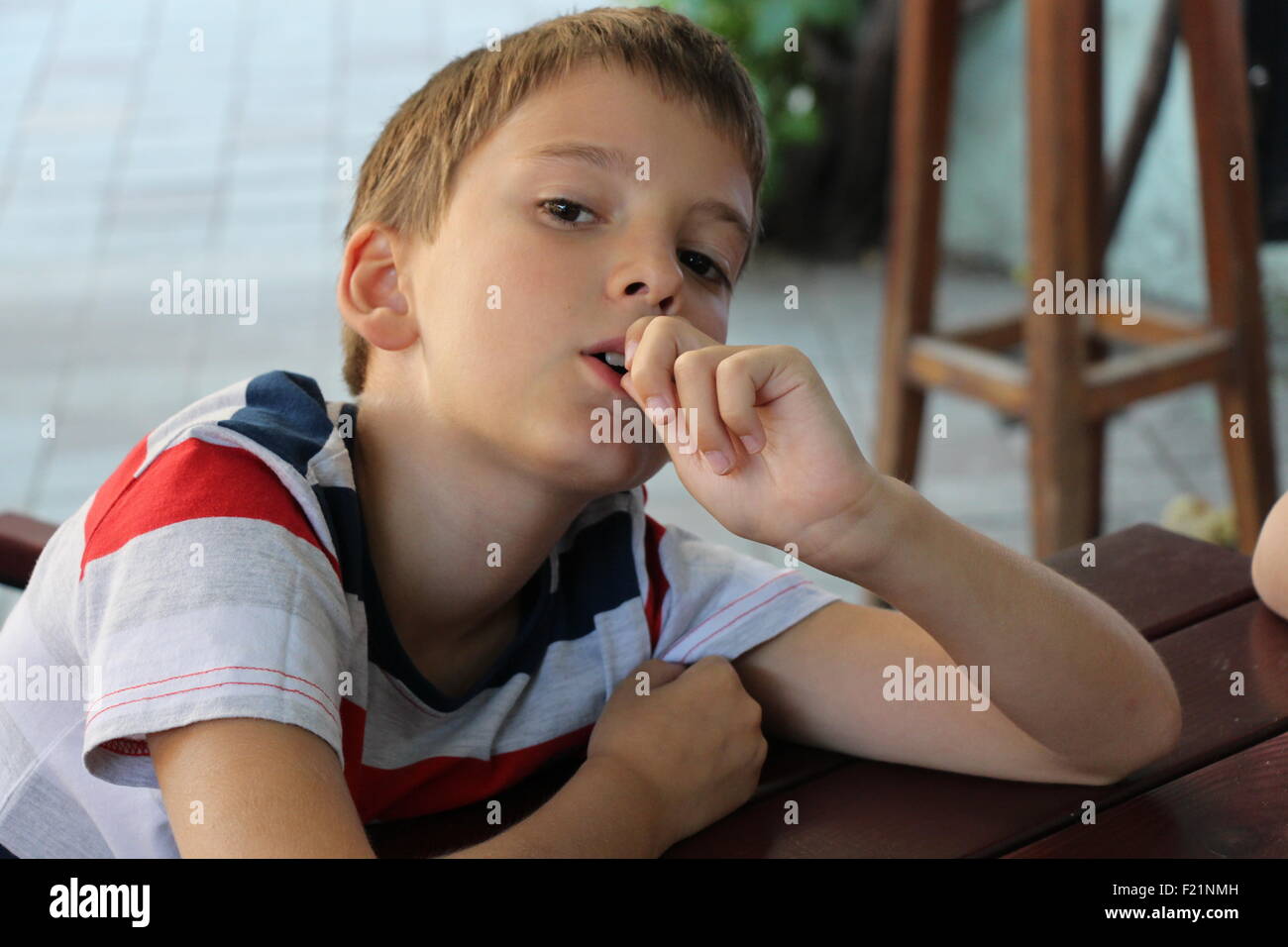 Young Georgian boy relaxing and thinking Stock Photo - Alamy