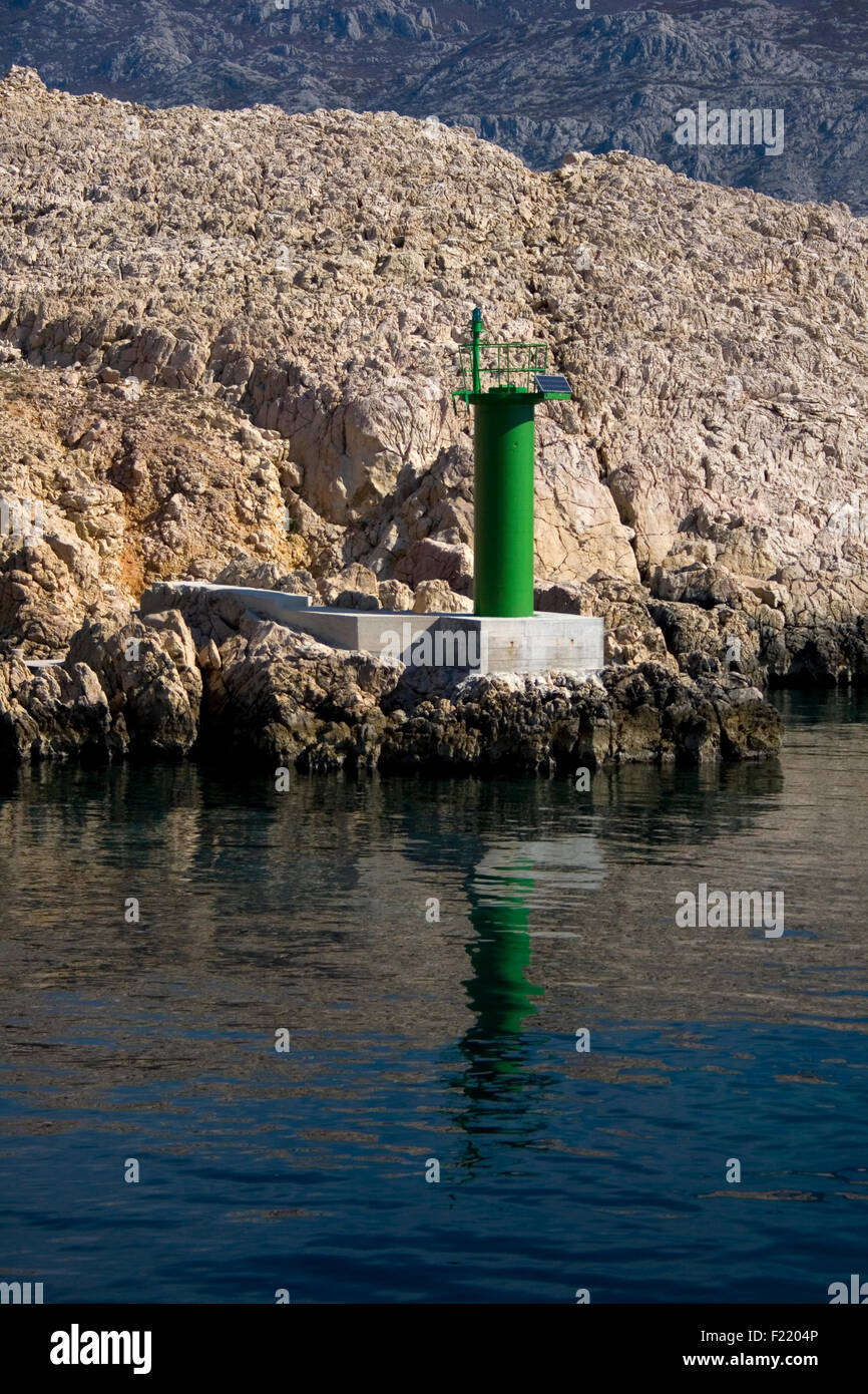 Little green lighthouse on sea Stock Photo - Alamy