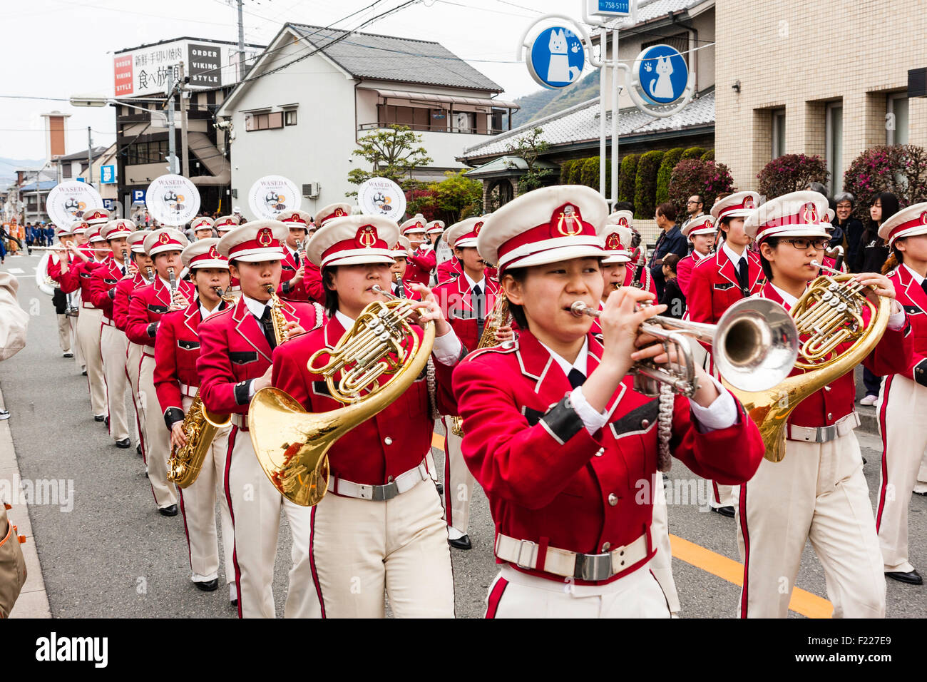 Genji Festival parade in Japan. Women's brass band marching at head of ...