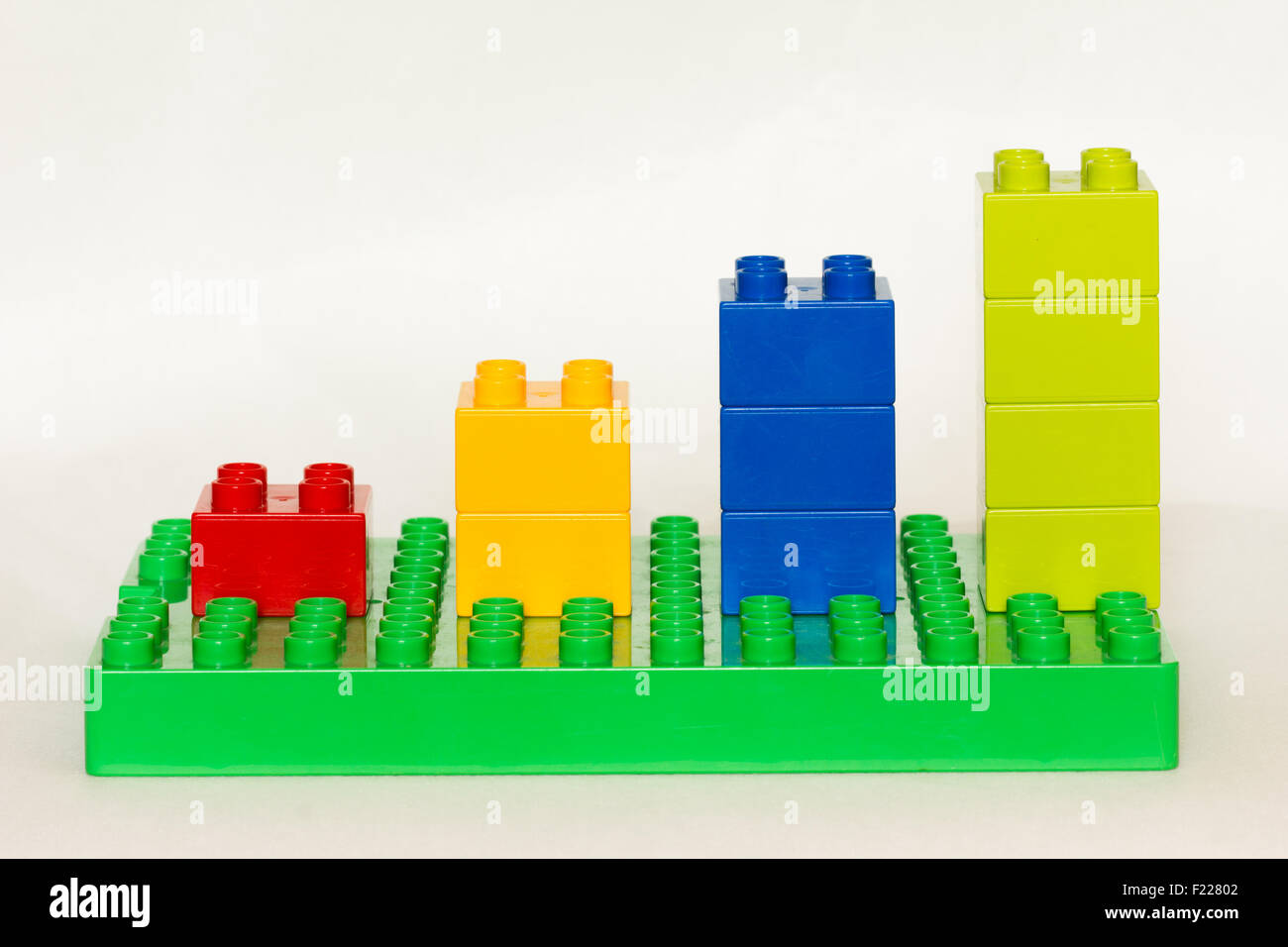 Lego building bricks in different colors over white background Stock ...