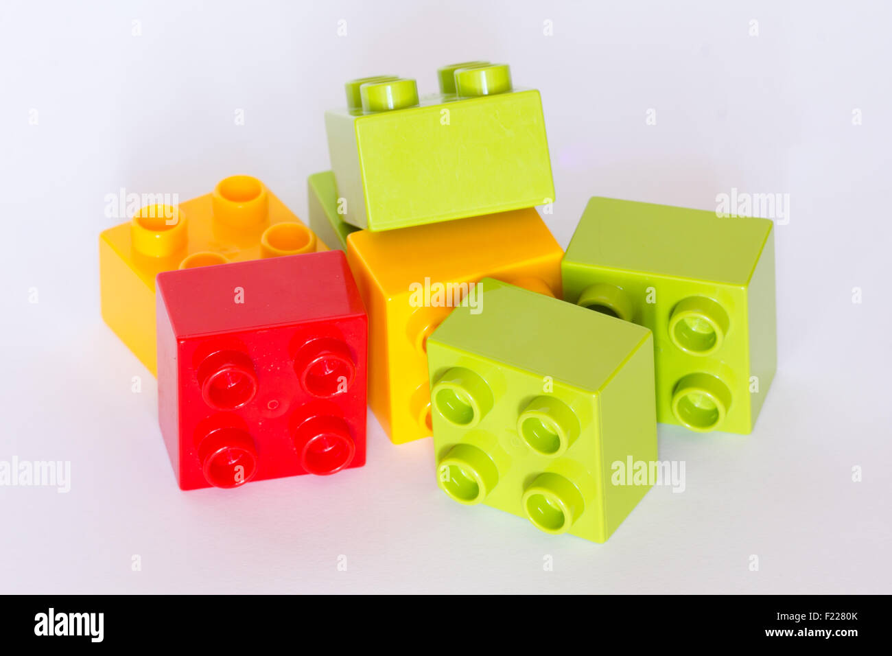 Lego building bricks in different colors over white background Stock ...