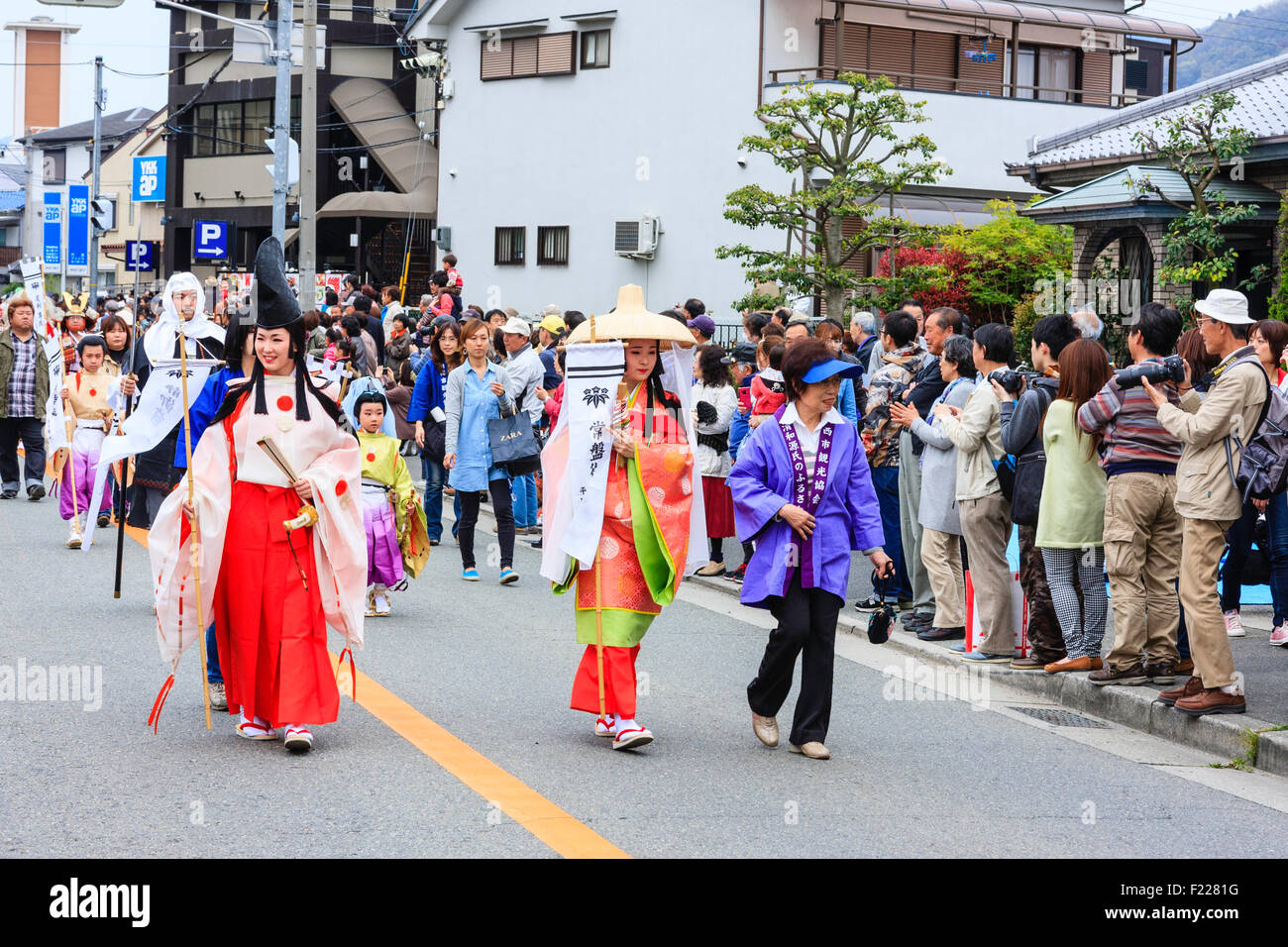 Genji festival parade in Japan. Two women, one dressed as a shirabyoshi ...