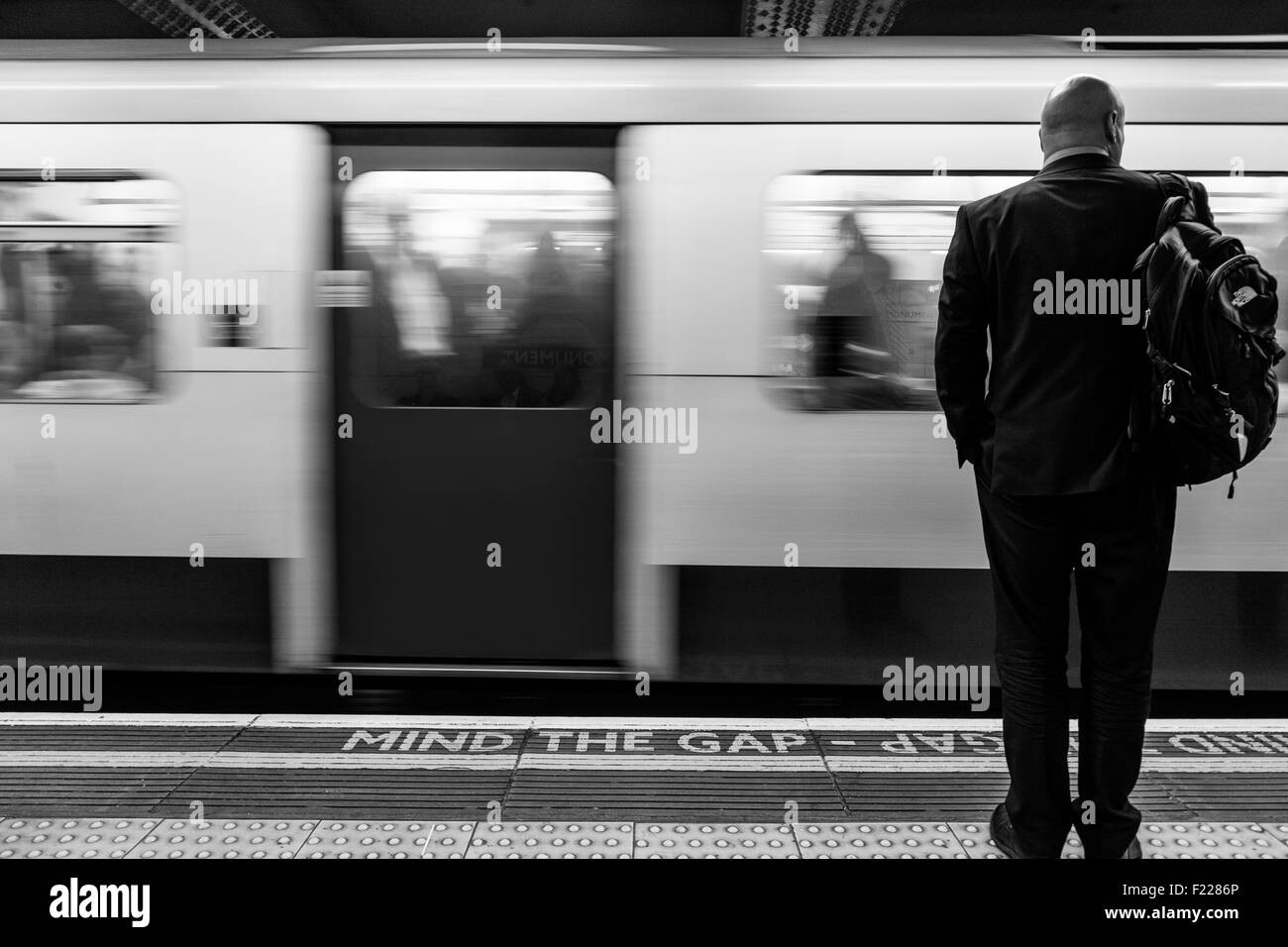 A Business Man In A Suit Waits For A Train, The London Underground ...