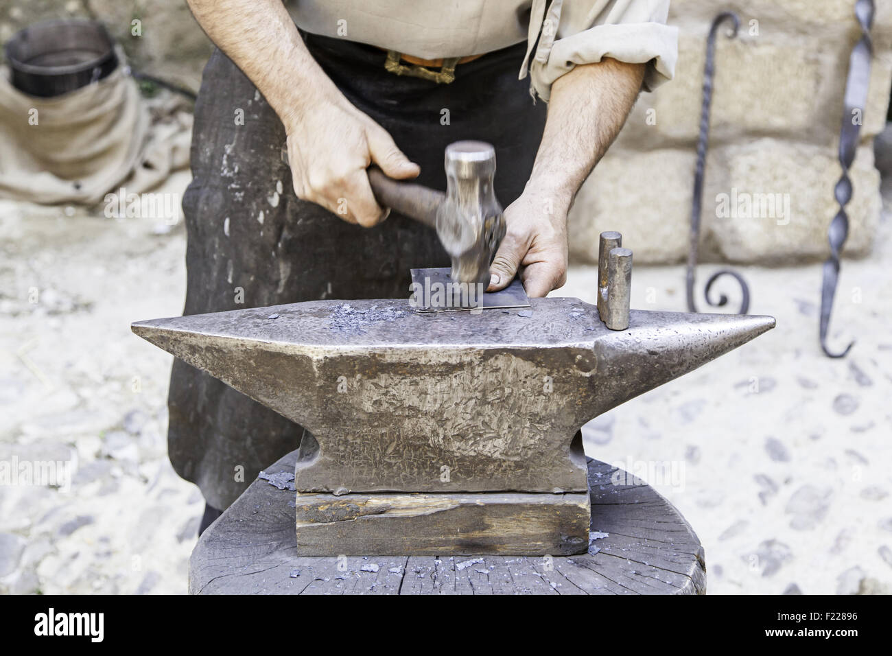 Hammer and anvil, detail of a forge, metal tools Stock Photo - Alamy