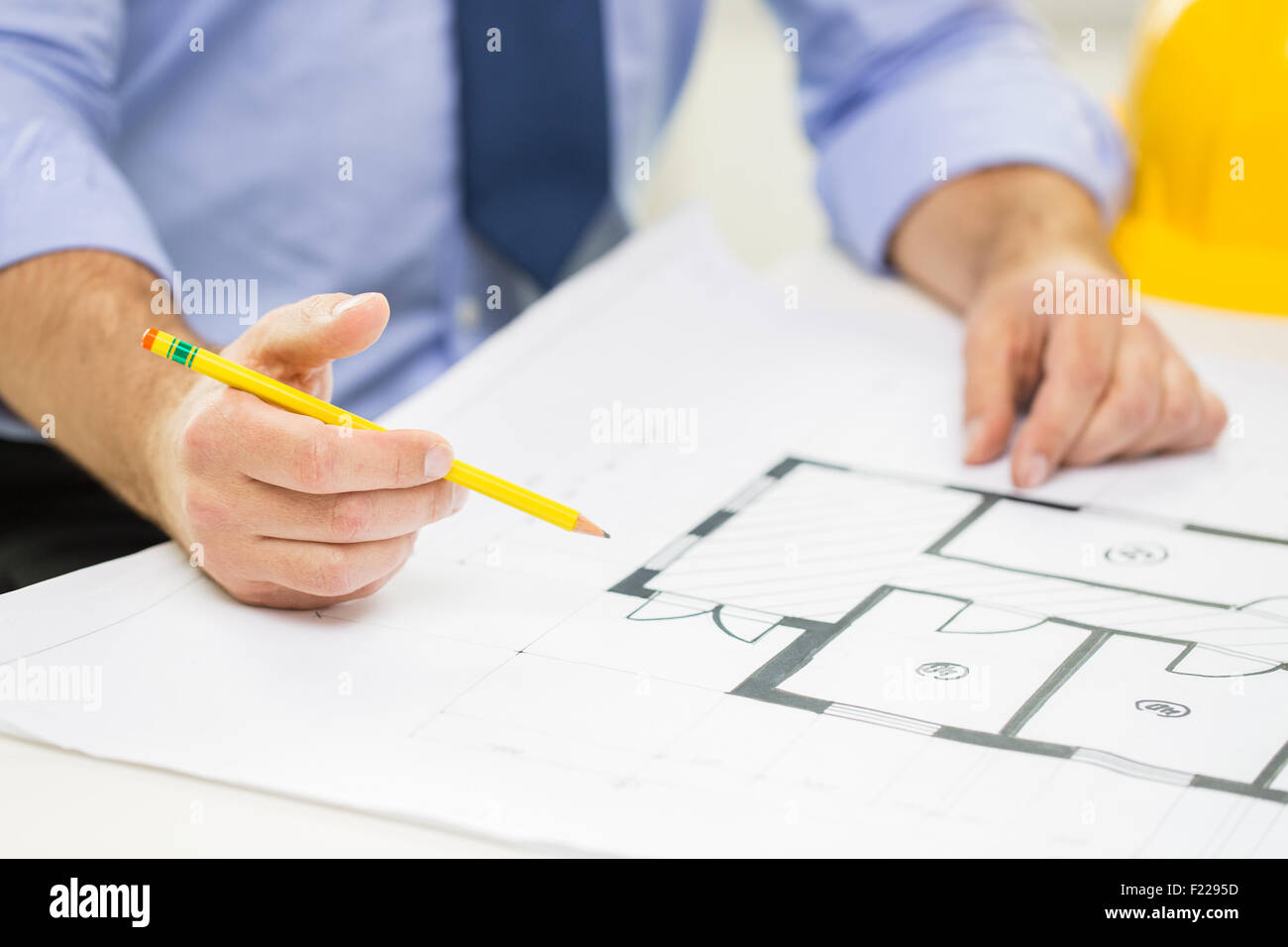 close up of male hand with blueprint and pencil Stock Photo - Alamy