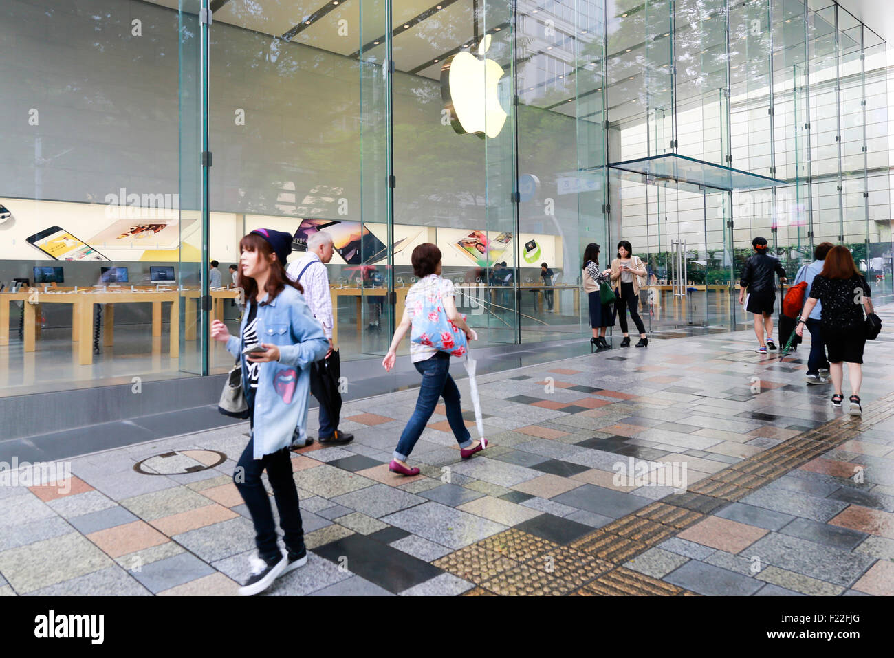 Pedestrians walk past the Apple Store in Omotesando on September 10 ...
