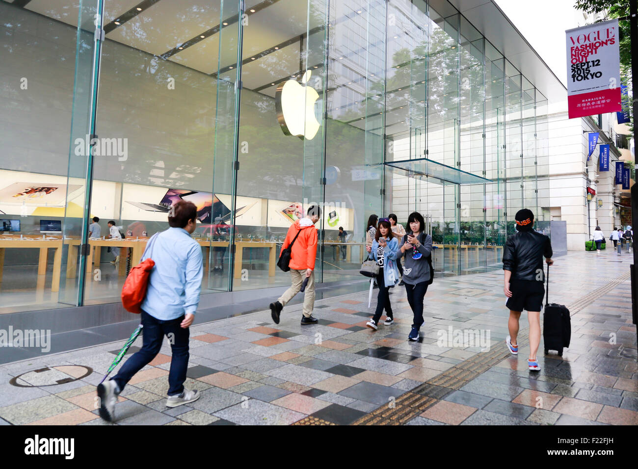 Pedestrians walk past the Apple Store in Omotesando on September 10 ...