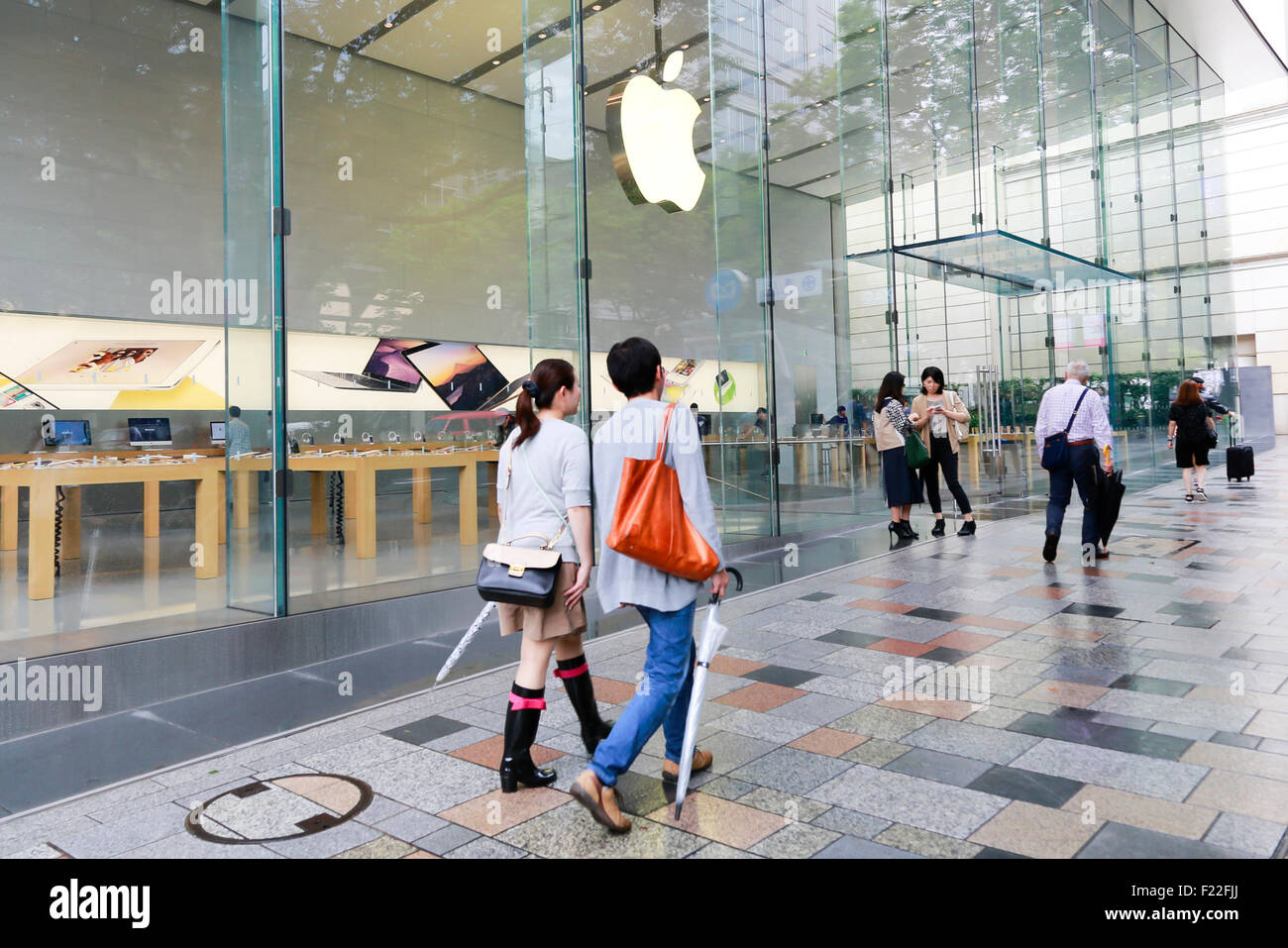 Pedestrians walk past the Apple Store in Omotesando on September 10 ...