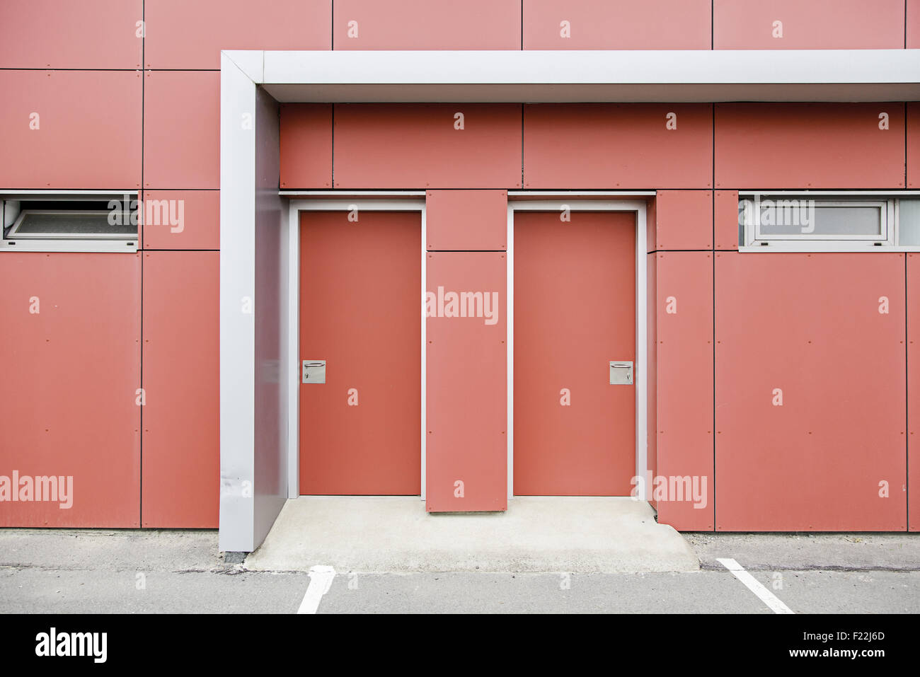 Industrial red doors, details of protective doors Stock Photo - Alamy