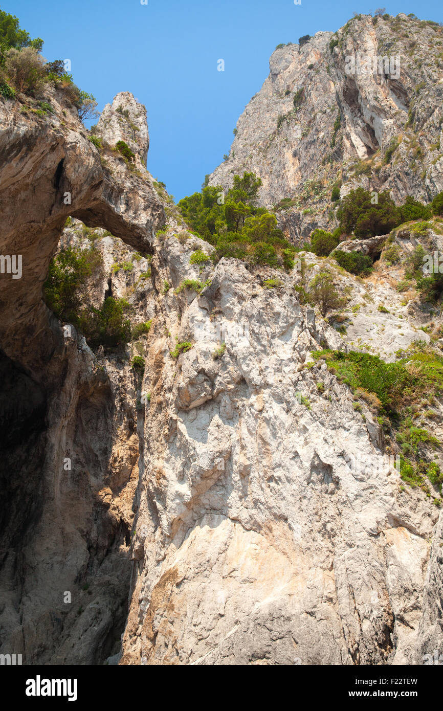 Vertical coastal landscape with rocks and cave. Capri island ...