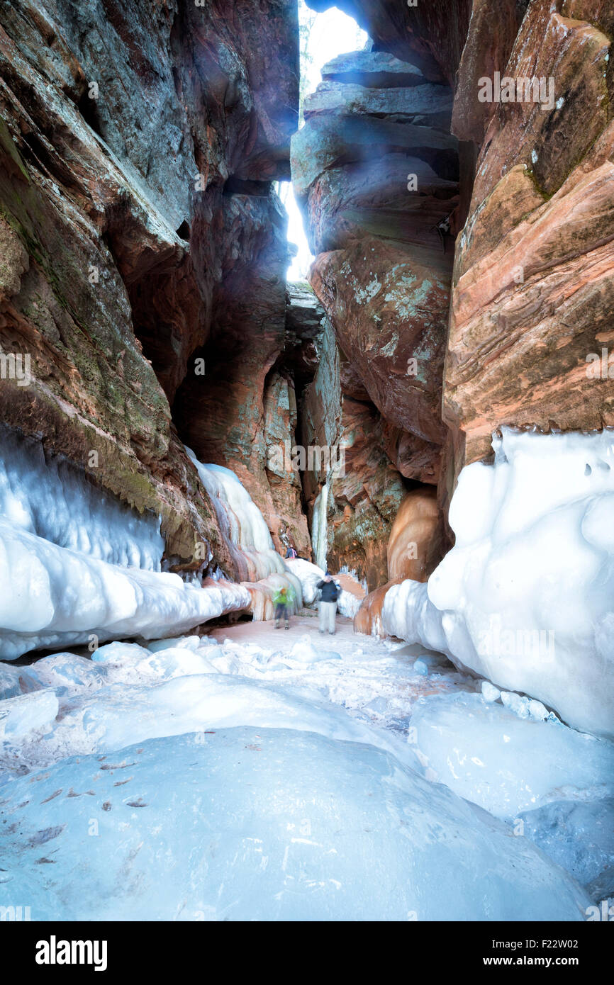 Narrow sandstone cavern on Lake Superior in winter at Apostle Islands ...