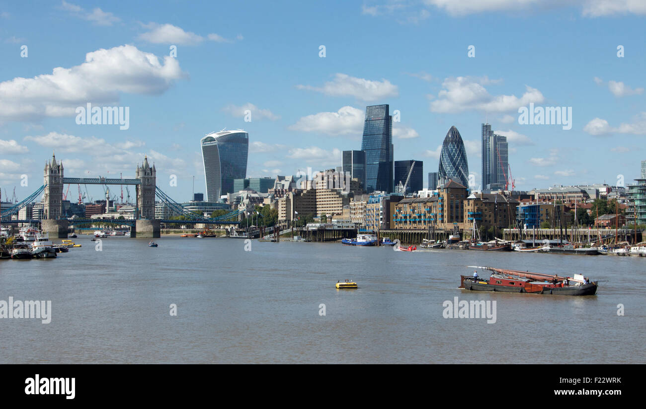 Traditional London barge cruising with its sail folded on the River ...
