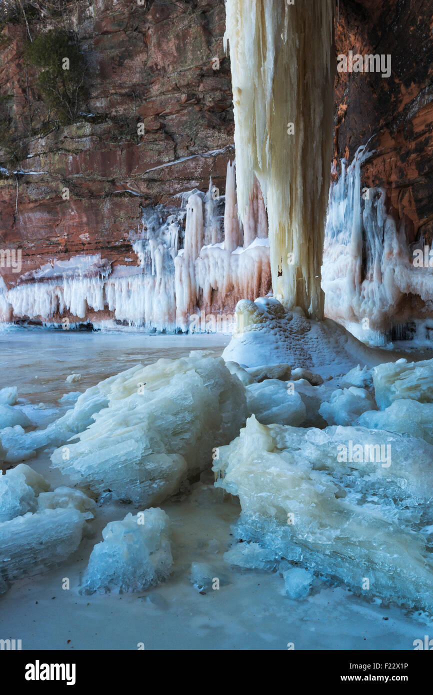 Yellow and orange tinted ice at the sandstone ice caves at Apostle ...