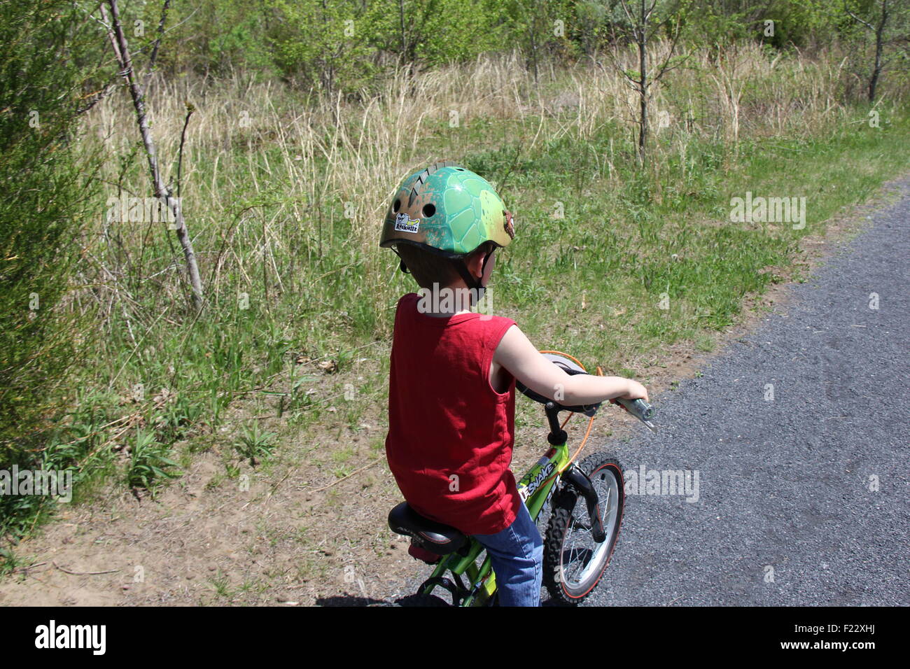 Boy riding his bike Stock Photo - Alamy