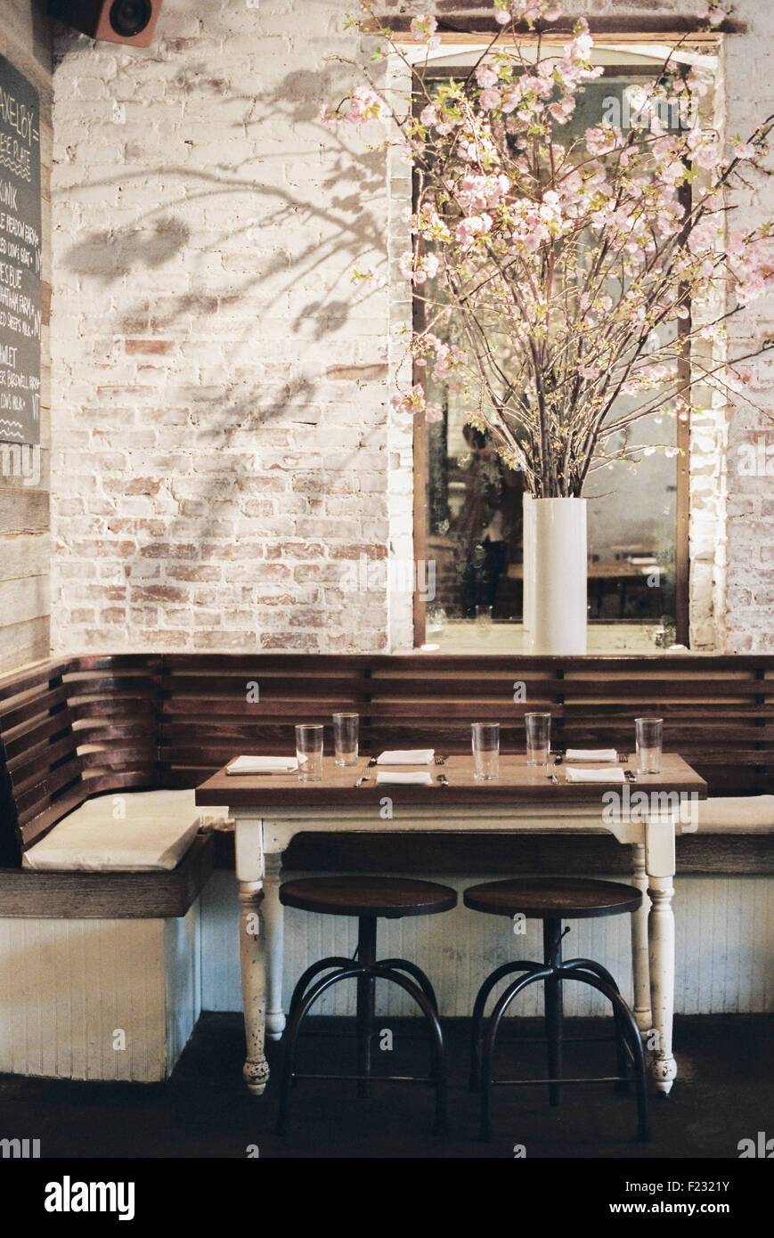 A small table with four place settings in a restaurant Stock Photo - Alamy
