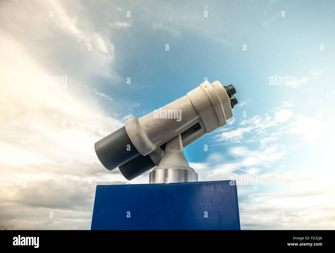 Tower viewer against blue cloudy sky Stock Photo - Alamy