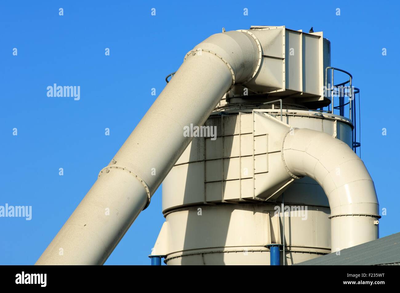 Metal pipes on the facade of a factory Stock Photo - Alamy