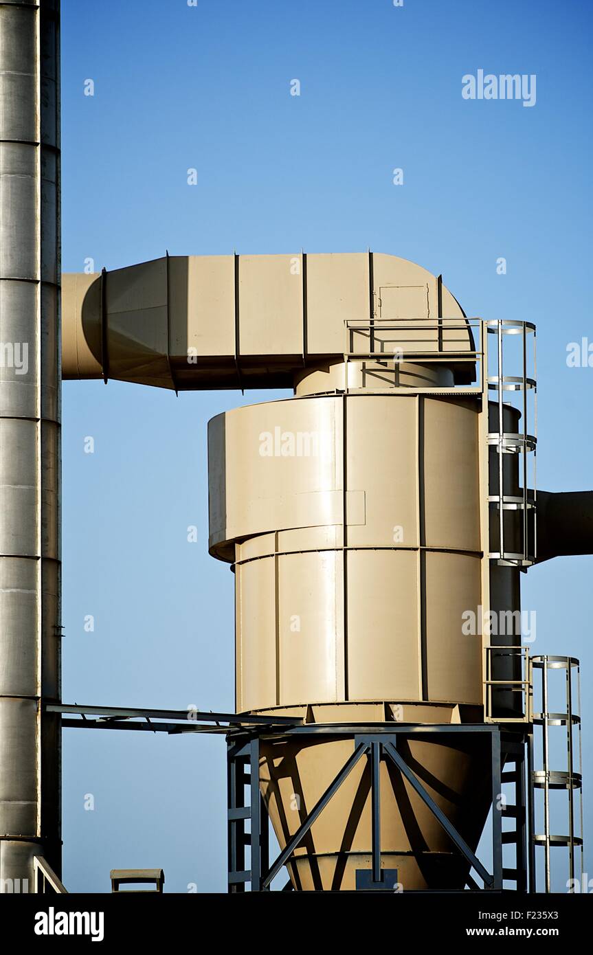 Metal pipes on the facade of a factory Stock Photo - Alamy