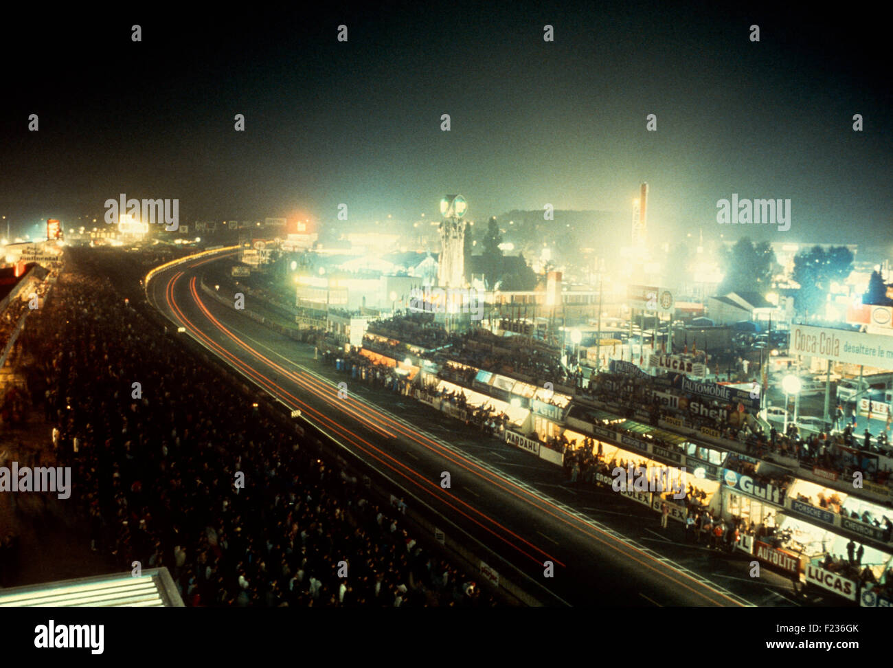 Pits scene at night at Le Mans 1960s Stock Photo - Alamy