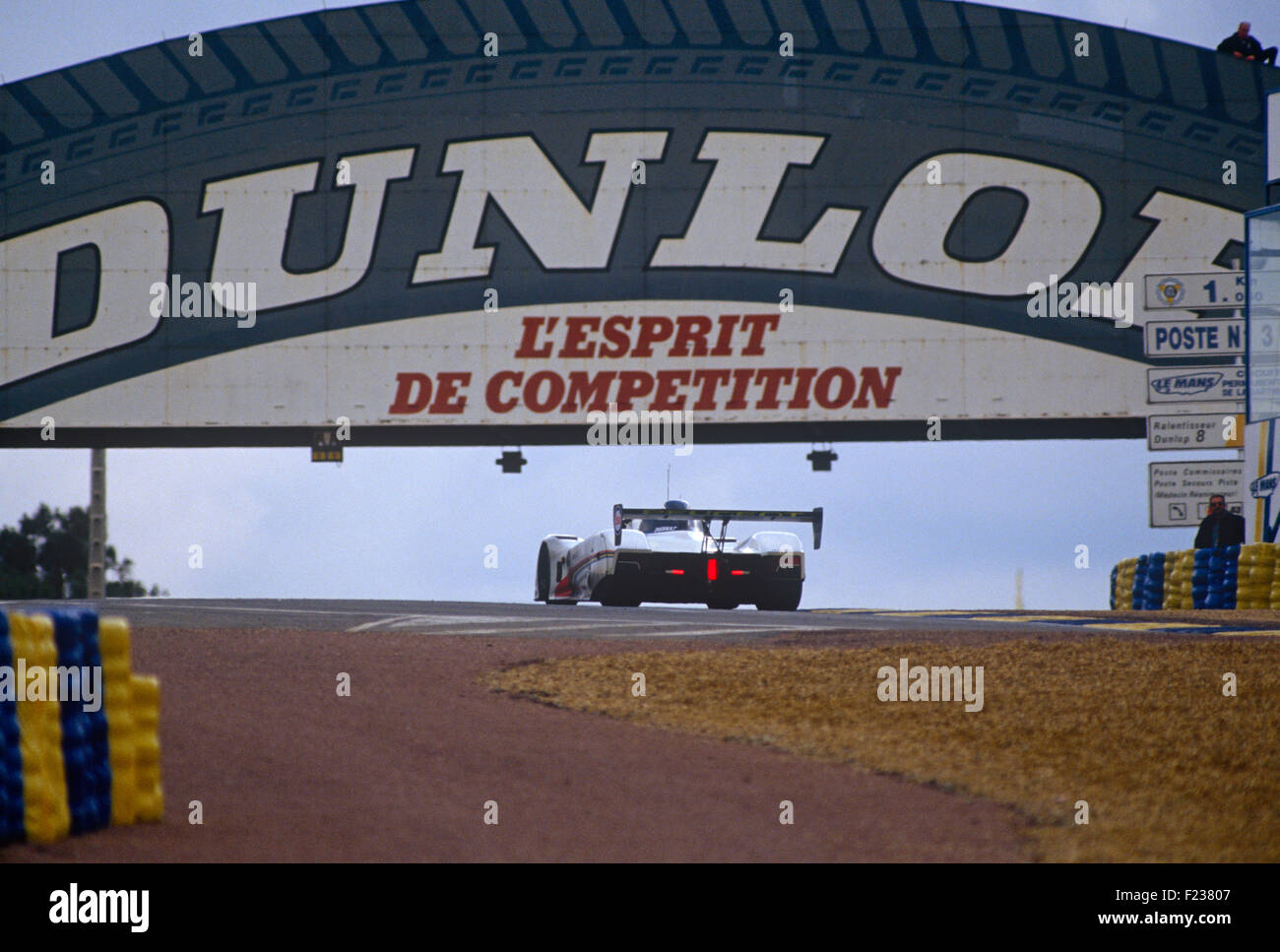 Peugeot sportscar racing under the Dunlop Bridge at Le Mans Stock Photo ...