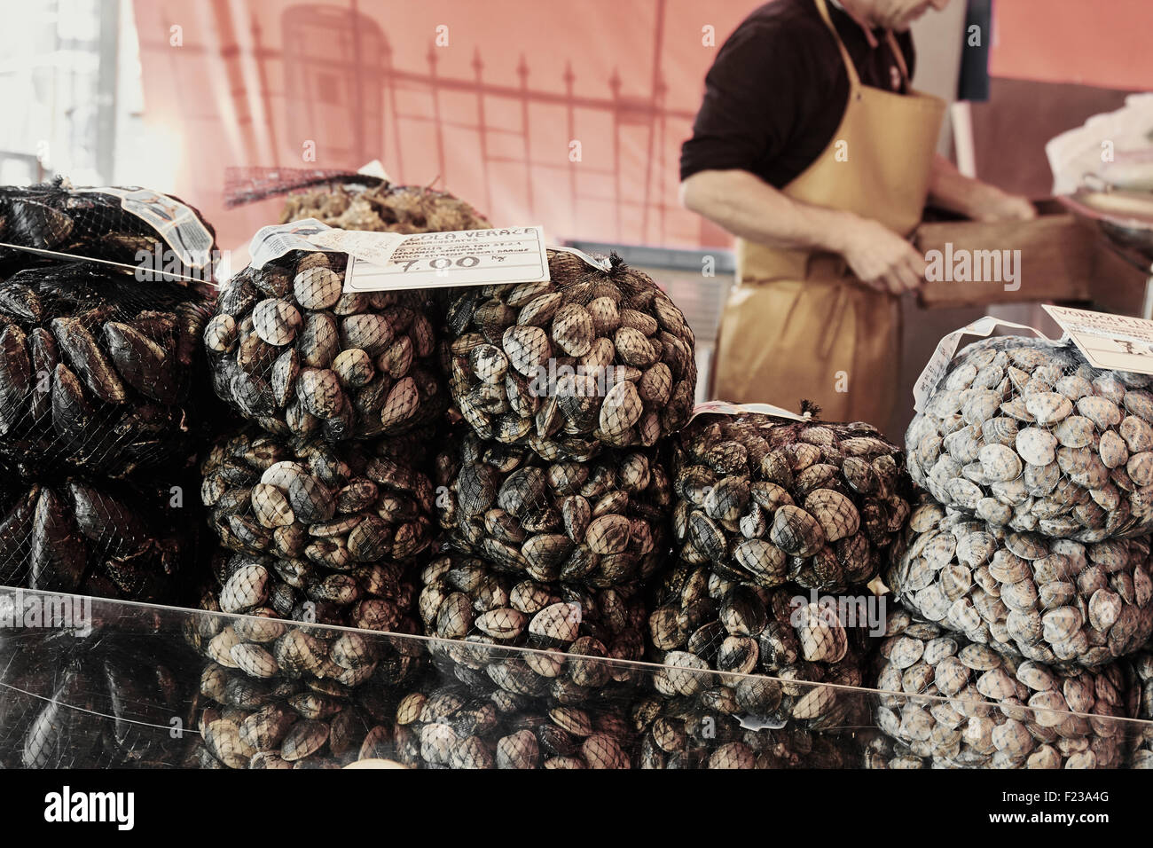 Net bags of clams and mussels for sale in Chioggia fish market Venetian ...