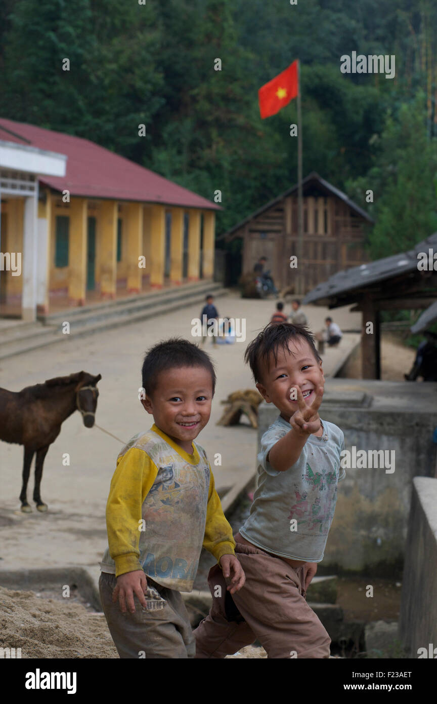 Two Hmong boys smile for the camera. Ban Pho village near Bac Ha, Lao ...