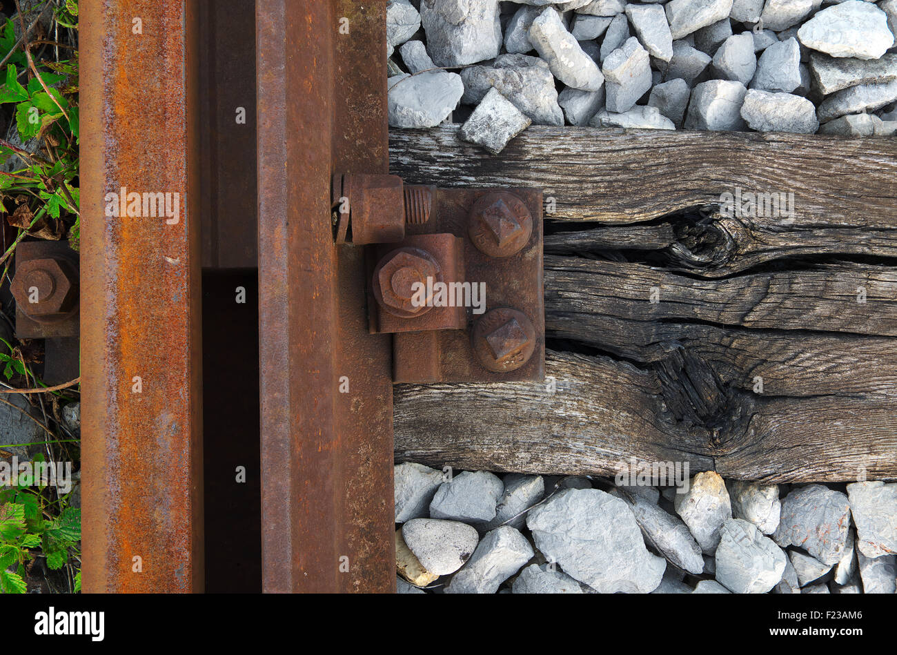 Rusty bolts and screws on a railroad track Stock Photo - Alamy