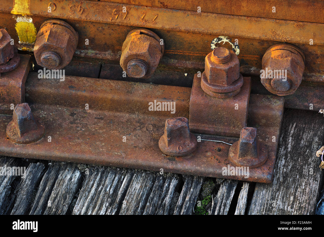 Rusty bolts and screws on a railroad track Stock Photo - Alamy
