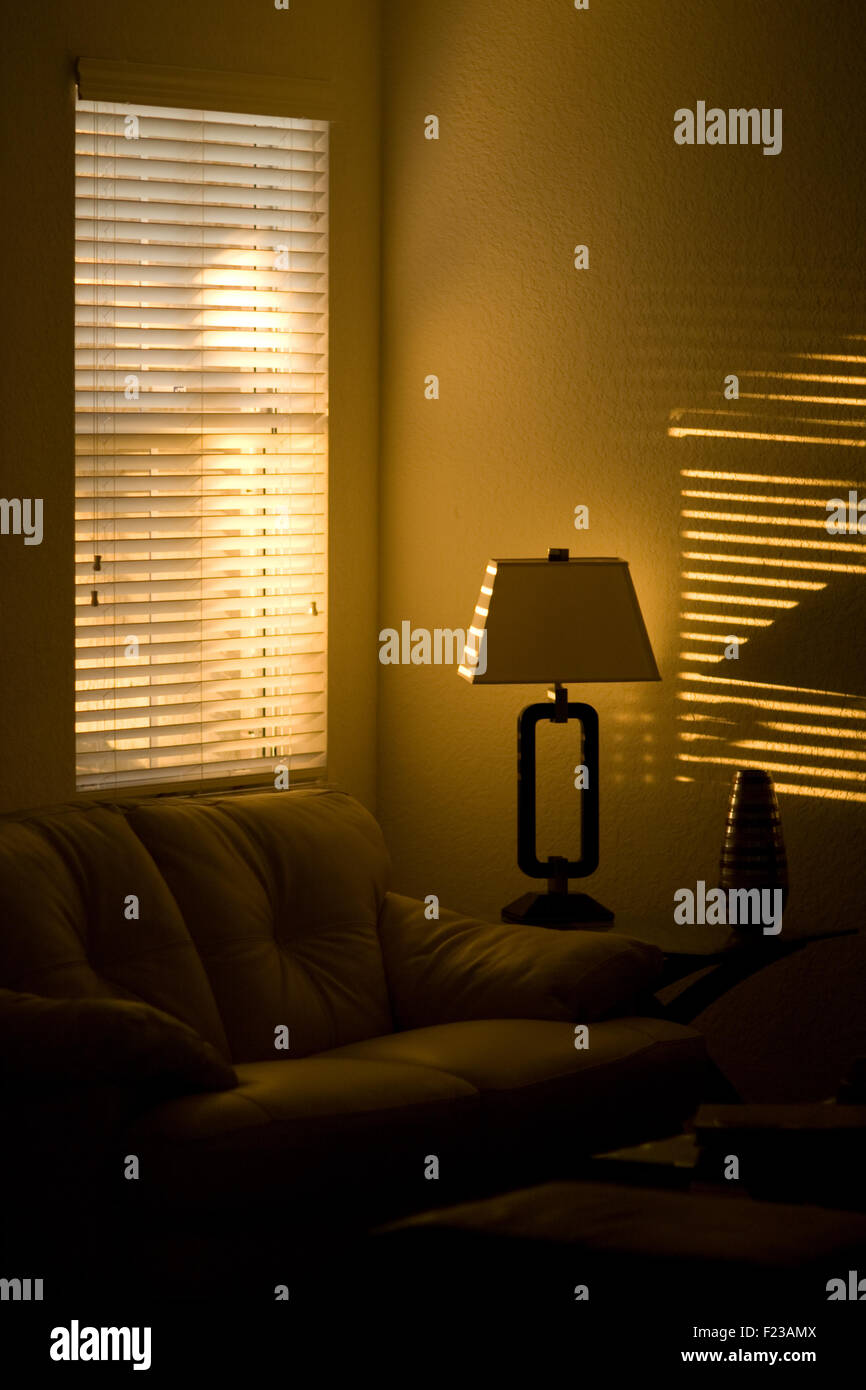 Details of a living room illuminated by the sun light pouring through ...