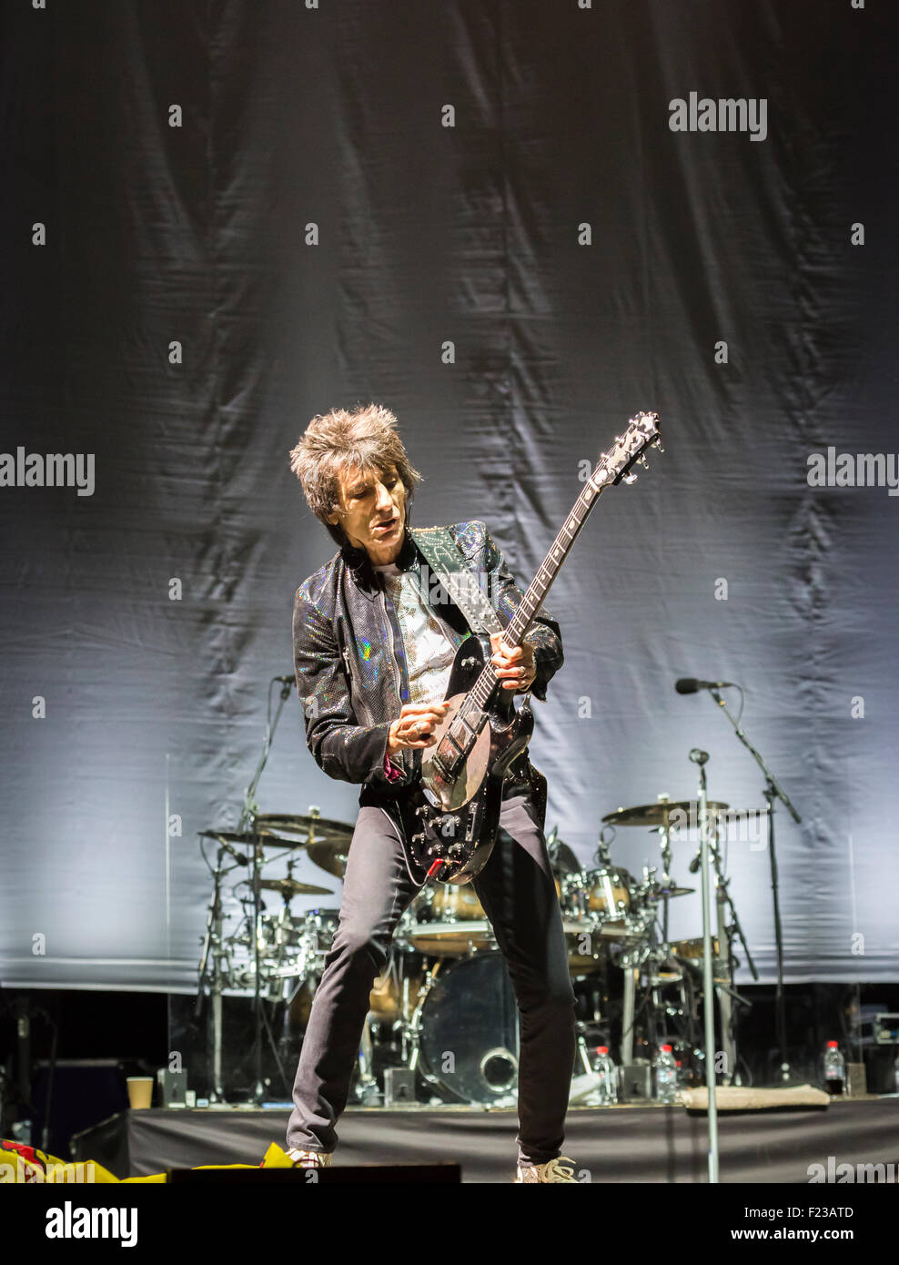 Ronnie Wood playing guitar with The Faces reunited, performing in concert live on stage ...