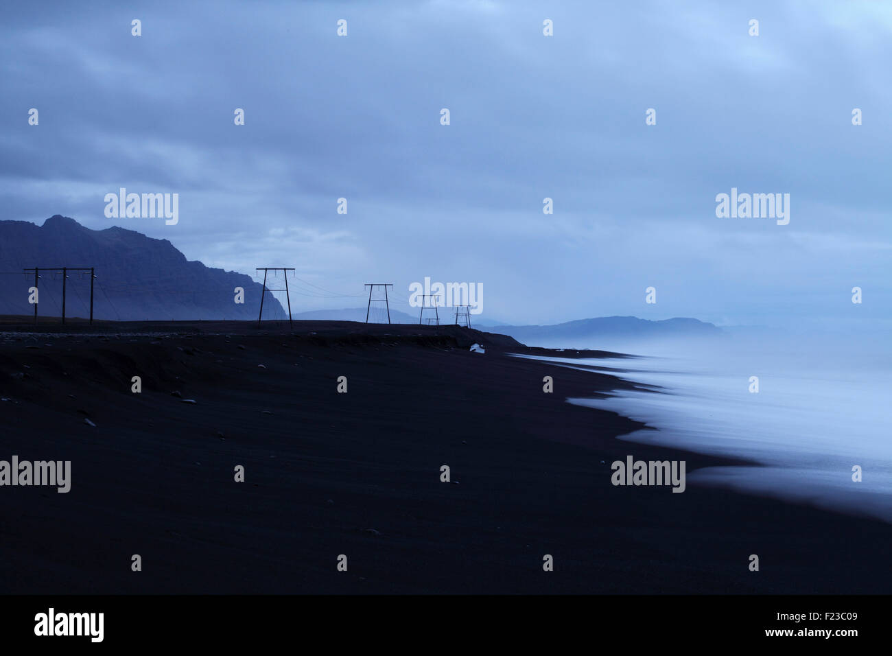 Pylons carry wires along the south-east coast of Iceland Stock Photo ...