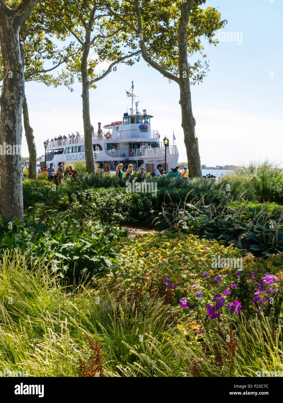 Battery Park with Statue of Liberty Ferry in Background, NYC Stock ...