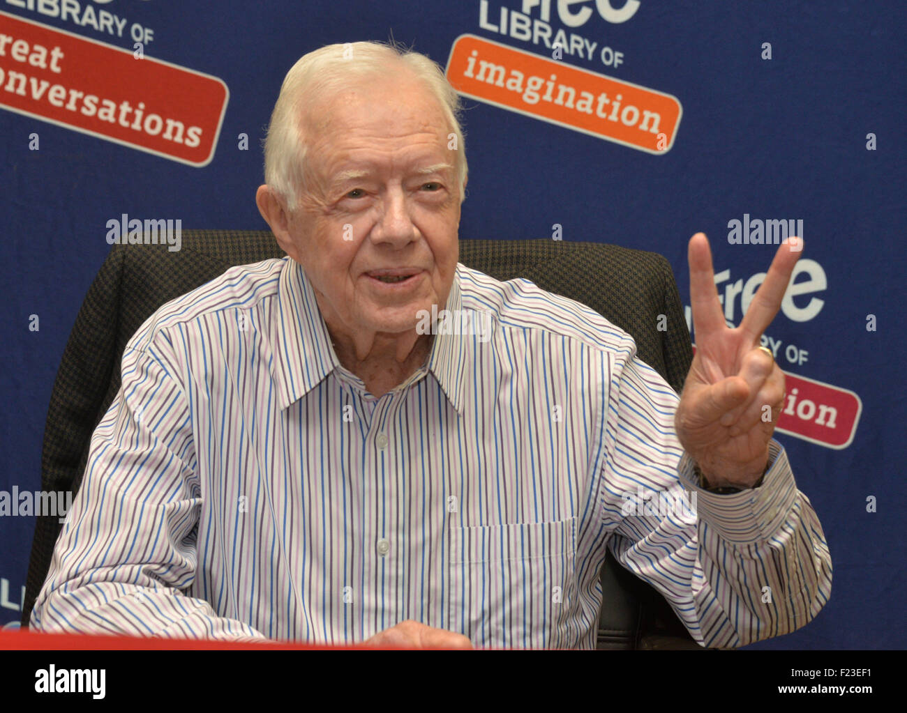 Former President of the United States Jimmy Carter signs copies of his ...