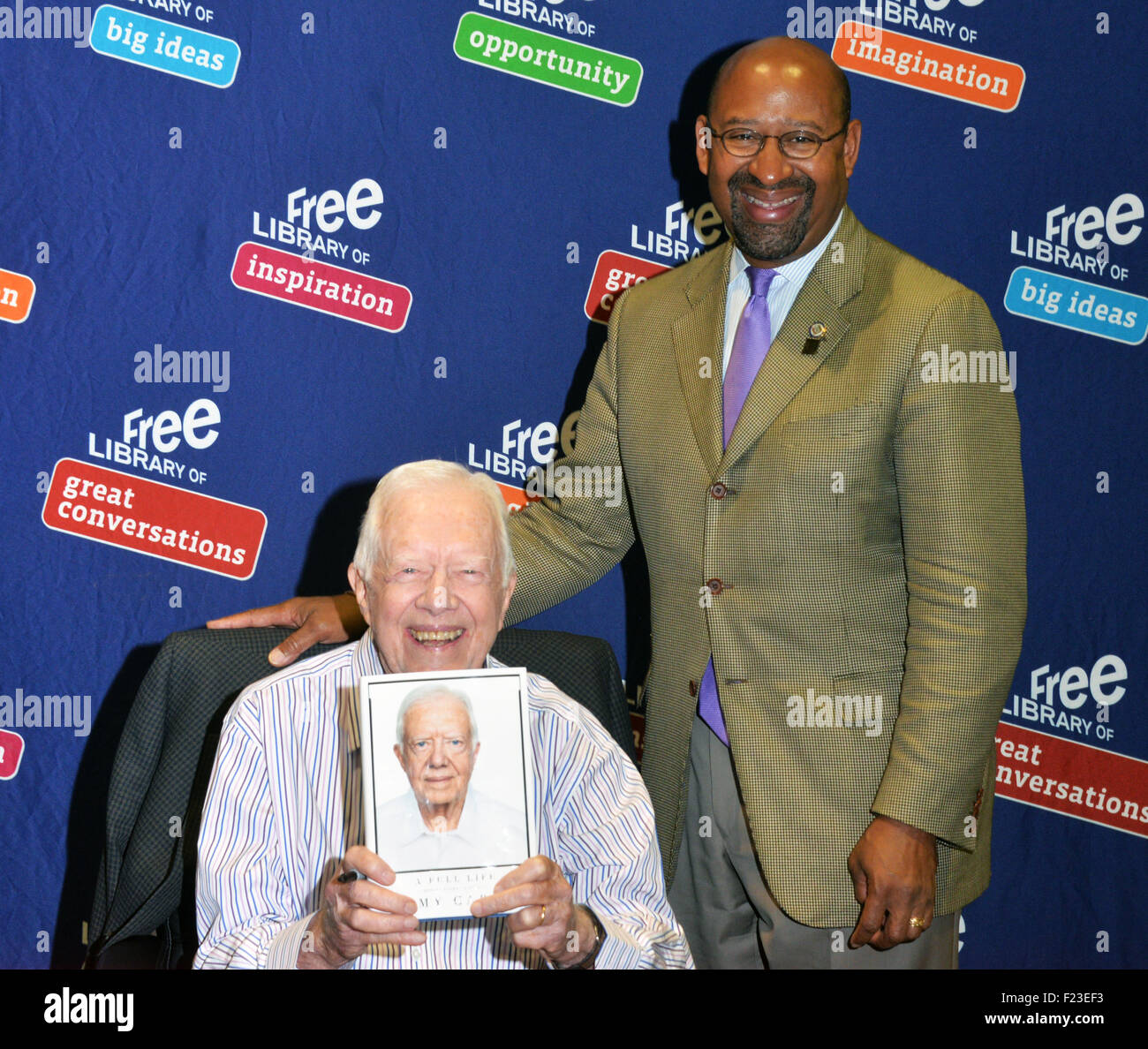 Former President of the United States Jimmy Carter signs copies of his ...
