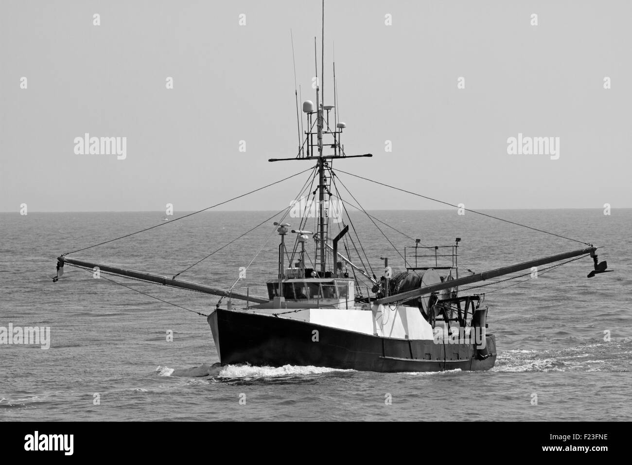 A commercial fishing trawler returning from work and about to enter the ...