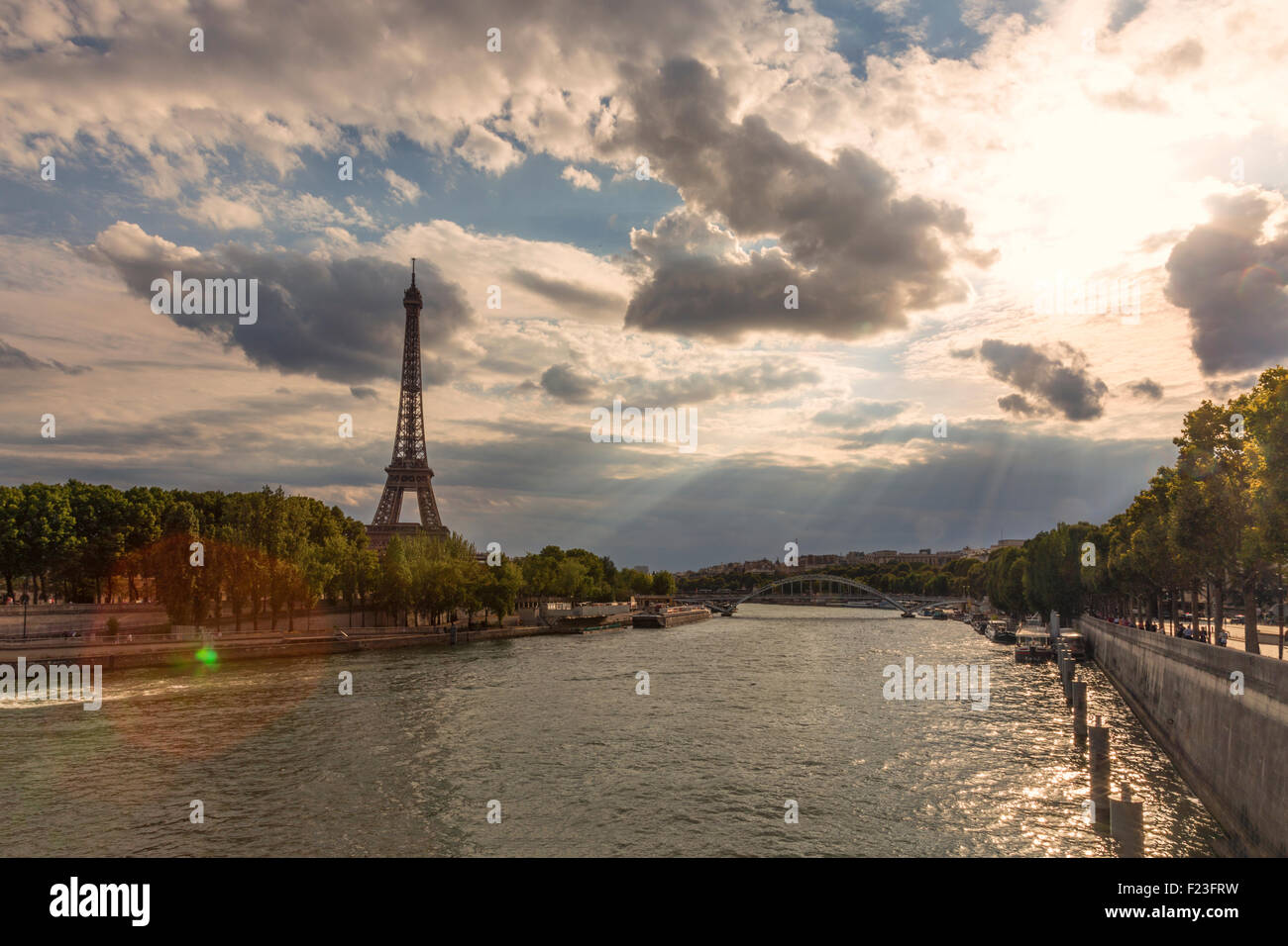 Landscape of Eiffel tower at sunset, with the Seine river in front ...