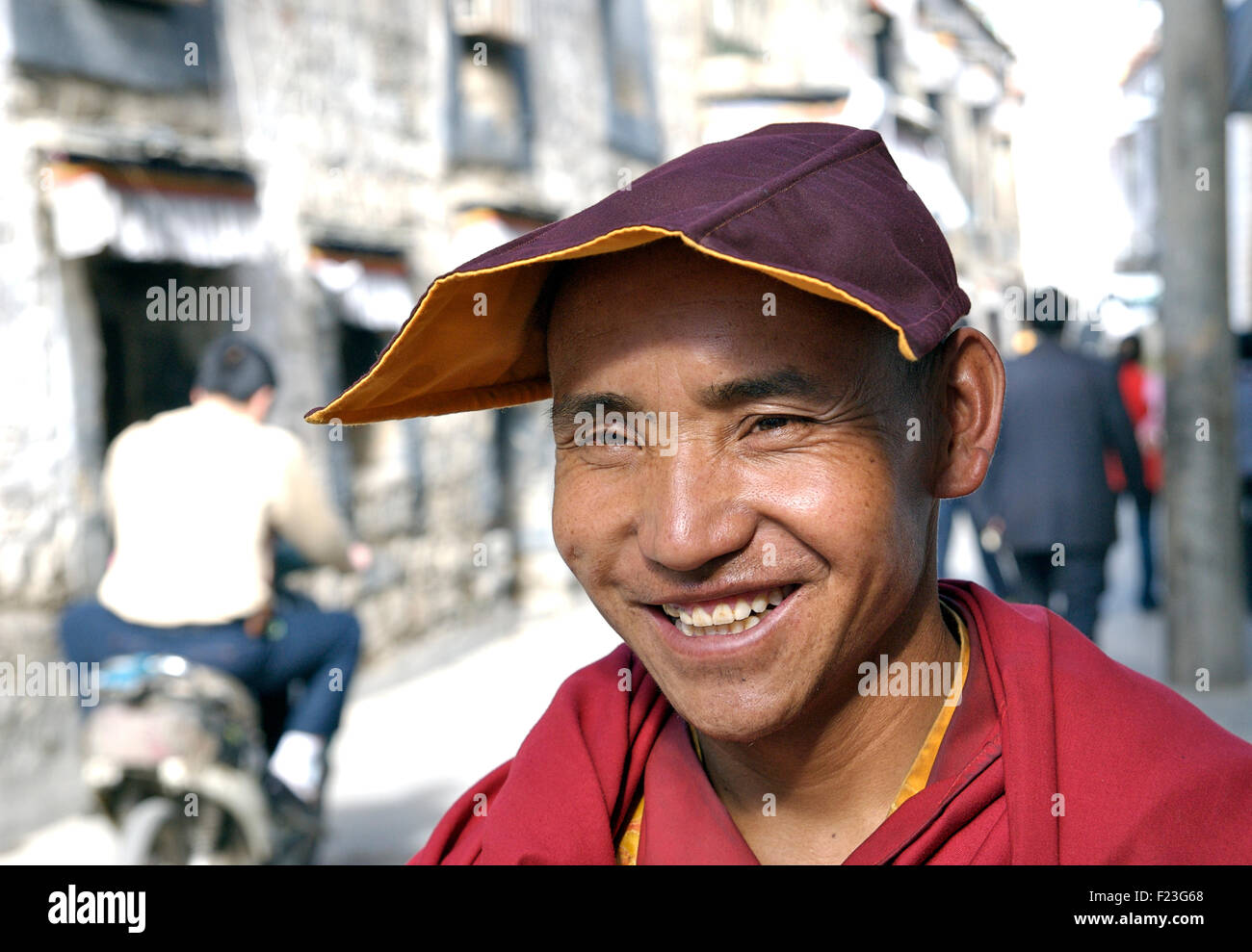 Portrait of a Tibetan buddhist monk in the old town area of Lhasa ...