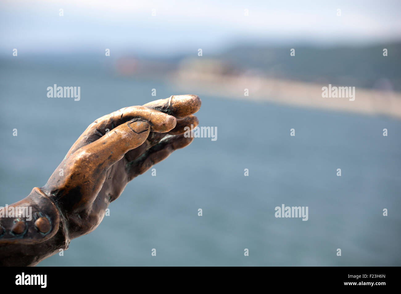 Hand of a bronze statue, Trieste Stock Photo - Alamy