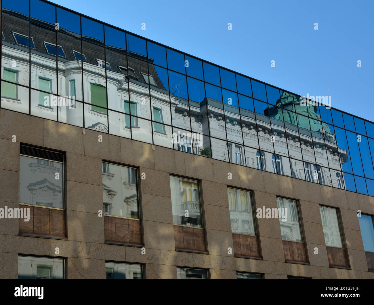 Old building reflecting in a new modern glass building Stock Photo - Alamy