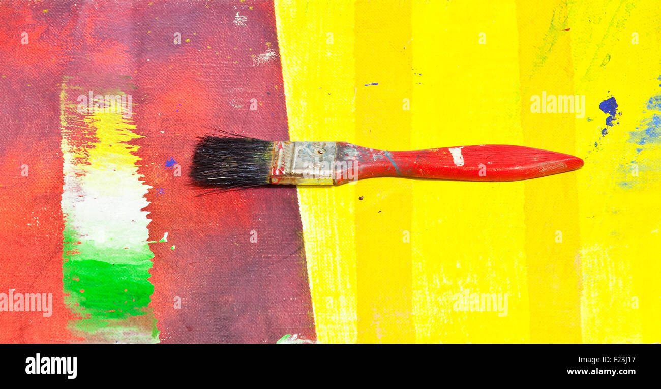 Paintbrush on colorful background Stock Photo - Alamy
