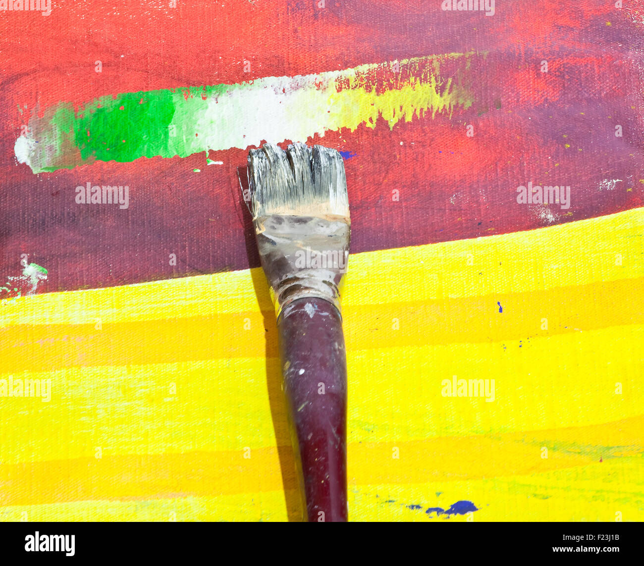 Paintbrush on colorful background Stock Photo - Alamy