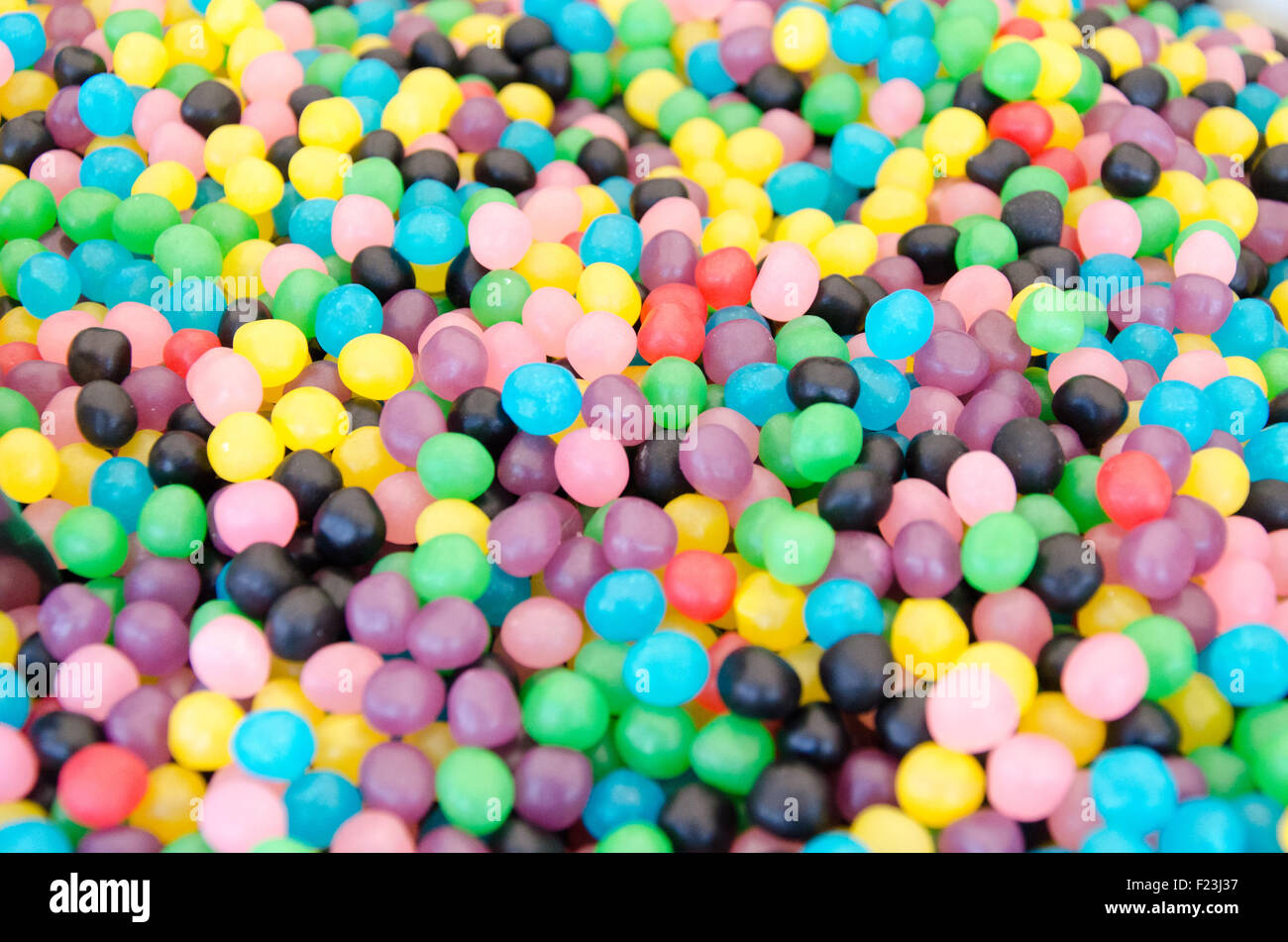 Mix dragibus sweets and colorful background Stock Photo - Alamy