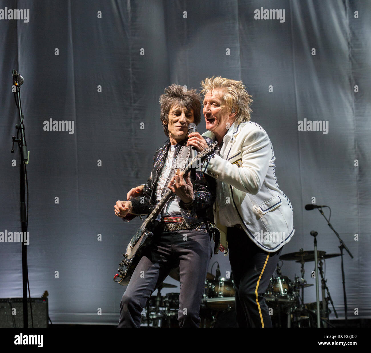 Rod Stewart and Ronnie Wood singing. The Faces, reunited, perform in concert live on stage ...