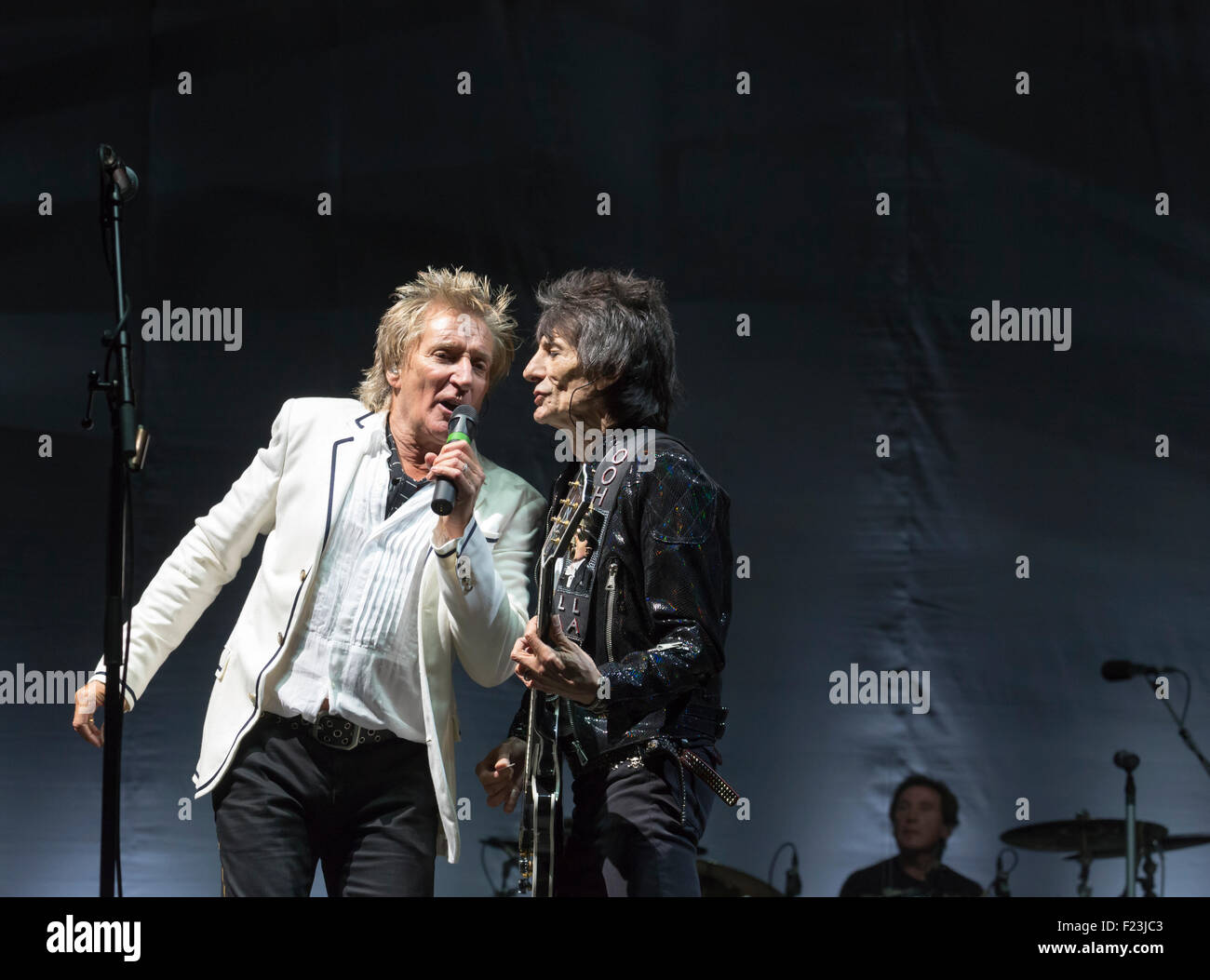Rod Stewart and Ronnie Wood singing. The Faces, reunited, perform in concert live on stage ...
