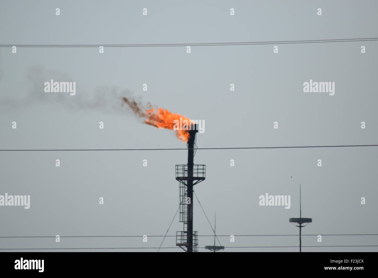 Torch system on an oil field Stock Photo - Alamy