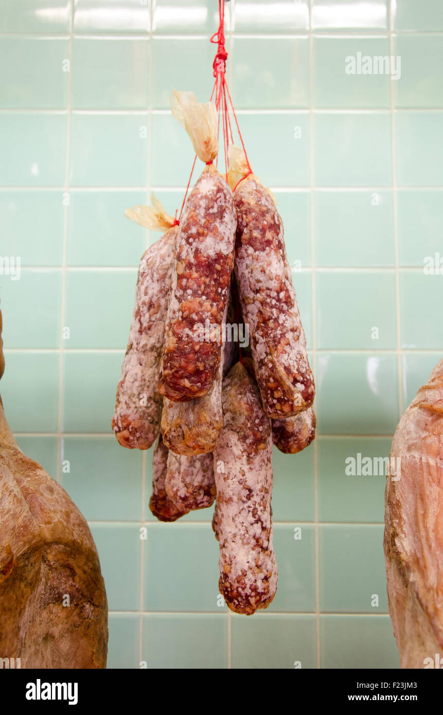 Saucisson ham jamon drying, hanging at the ceiling Stock Photo - Alamy