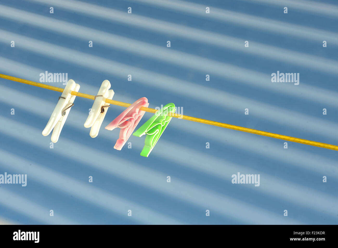 Clothes pegs on a washing line Stock Photo - Alamy